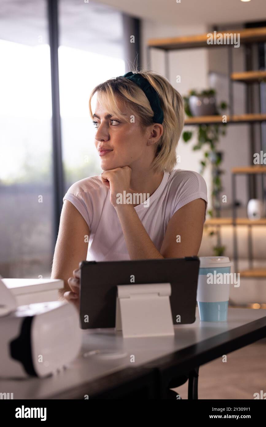 Woman thinking in office setting hi-res stock photography and images ...