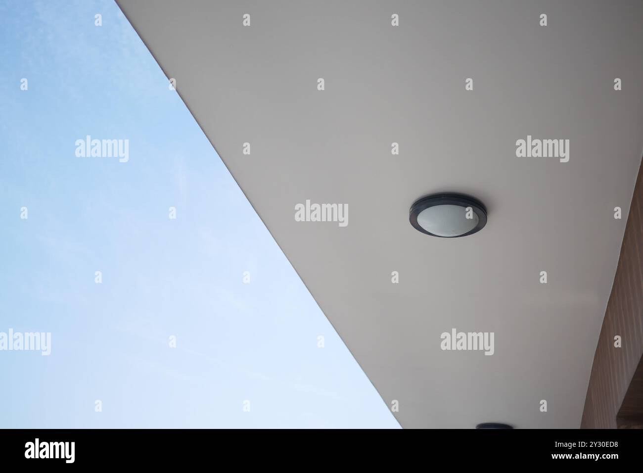 A Stunning Modern Architectural Ceiling Featuring a Stylish Light ...