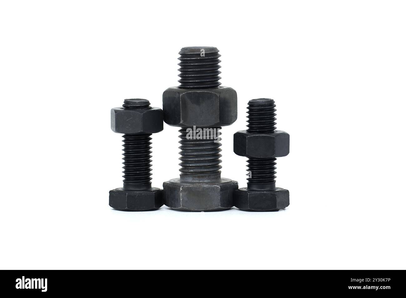 Assorted metal bolts and nuts on a white background. Ideal for ...