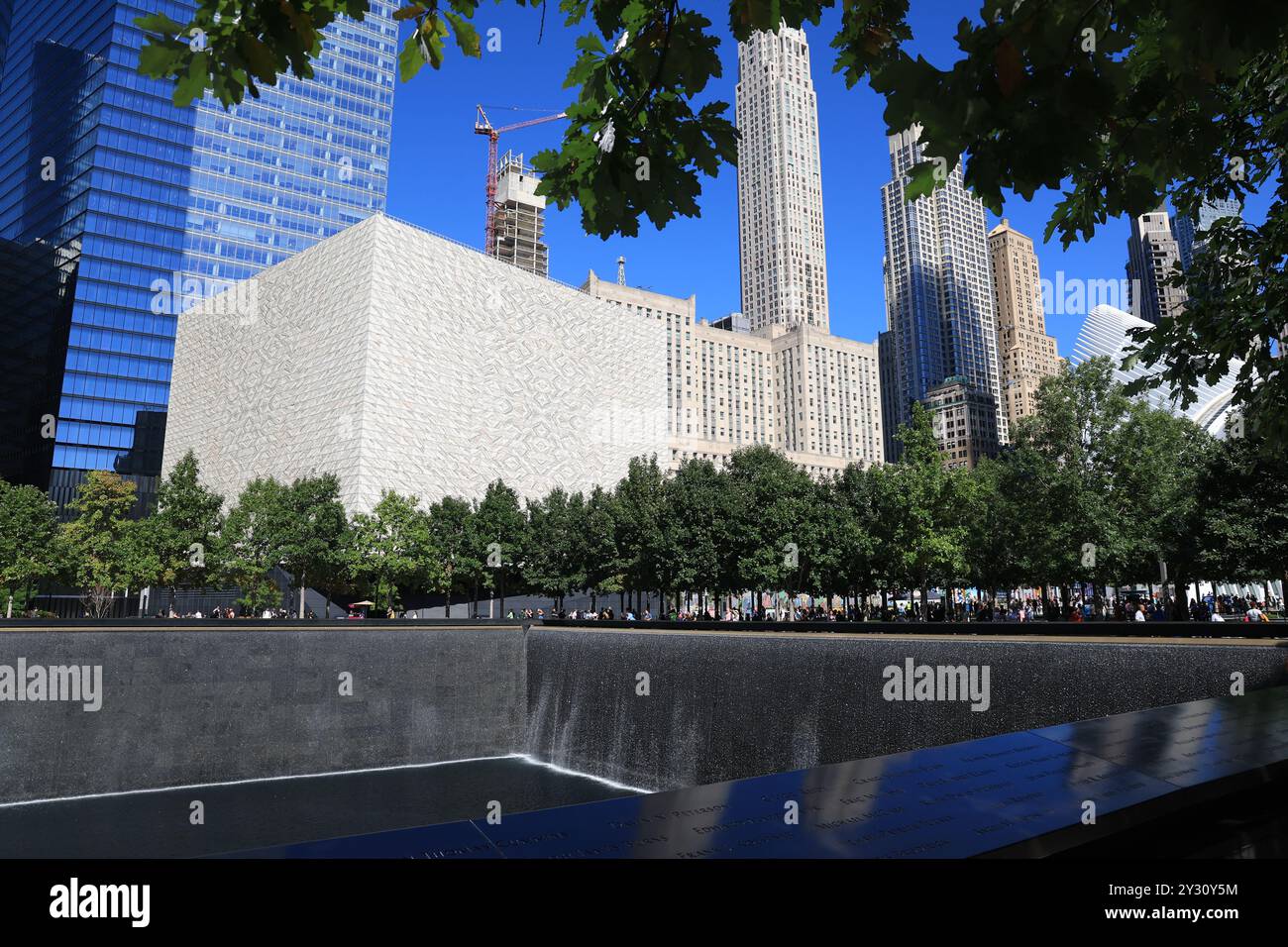Tourists visit one of the two reflecting pools at the National ...