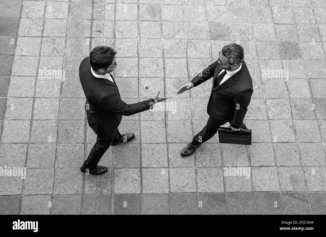 Business man shaking hands. Two businessmen handshake outdoor ...