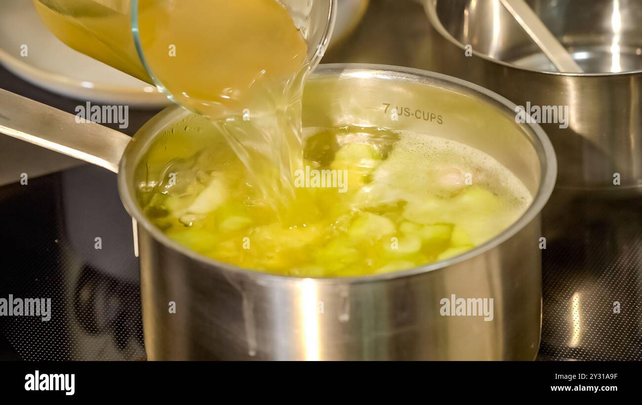 Chef adds spice soup hi-res stock photography and images - Alamy