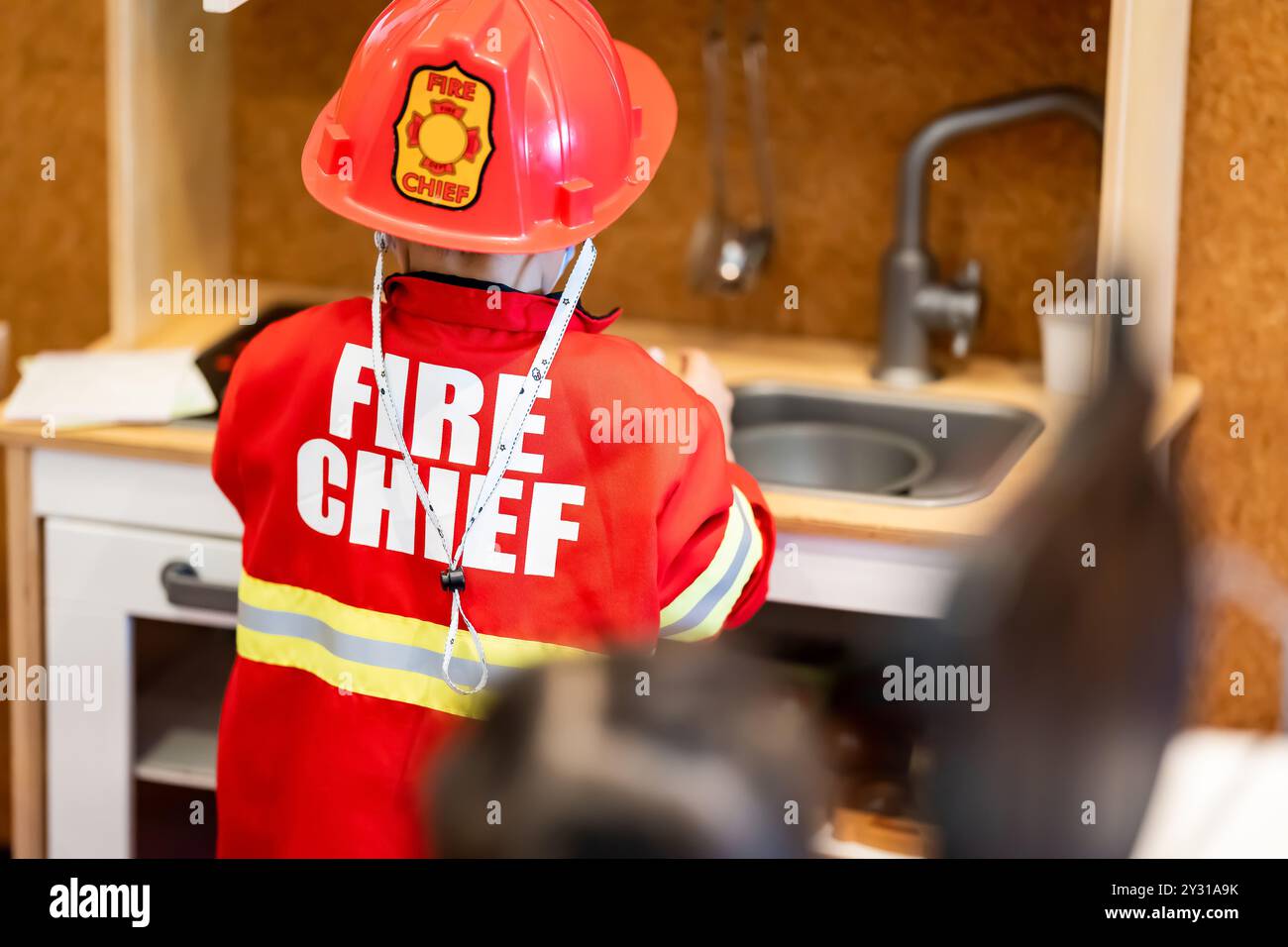 Little boy playing as fireman police occupation in education concept by ...