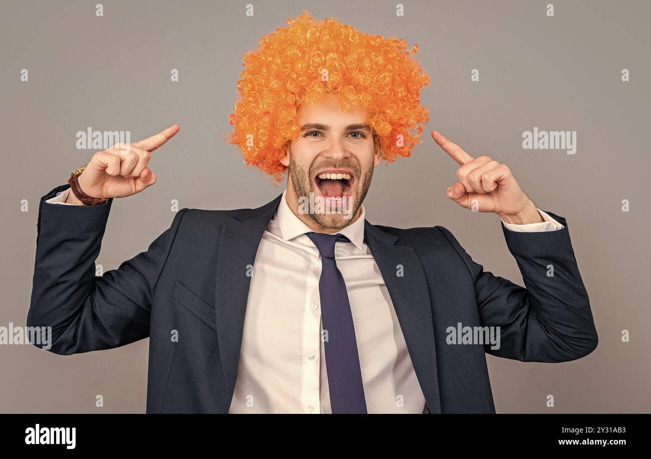 Businessman point finger on crazy wig. Business party. Business man at ...