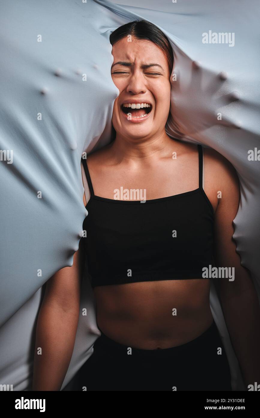 Sheet, hands and woman with scared, depression and screaming for ...