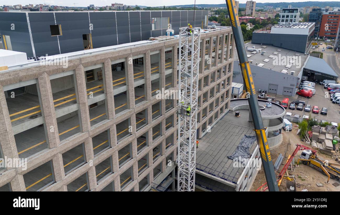 Aerial view of a construction site featuring cranes, construction ...