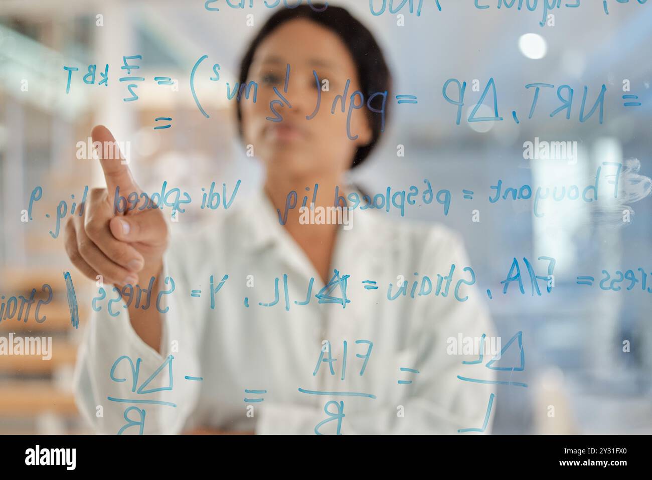 Woman, scientist and glass board with equation for brainstorming, problem solving or mathematics ...