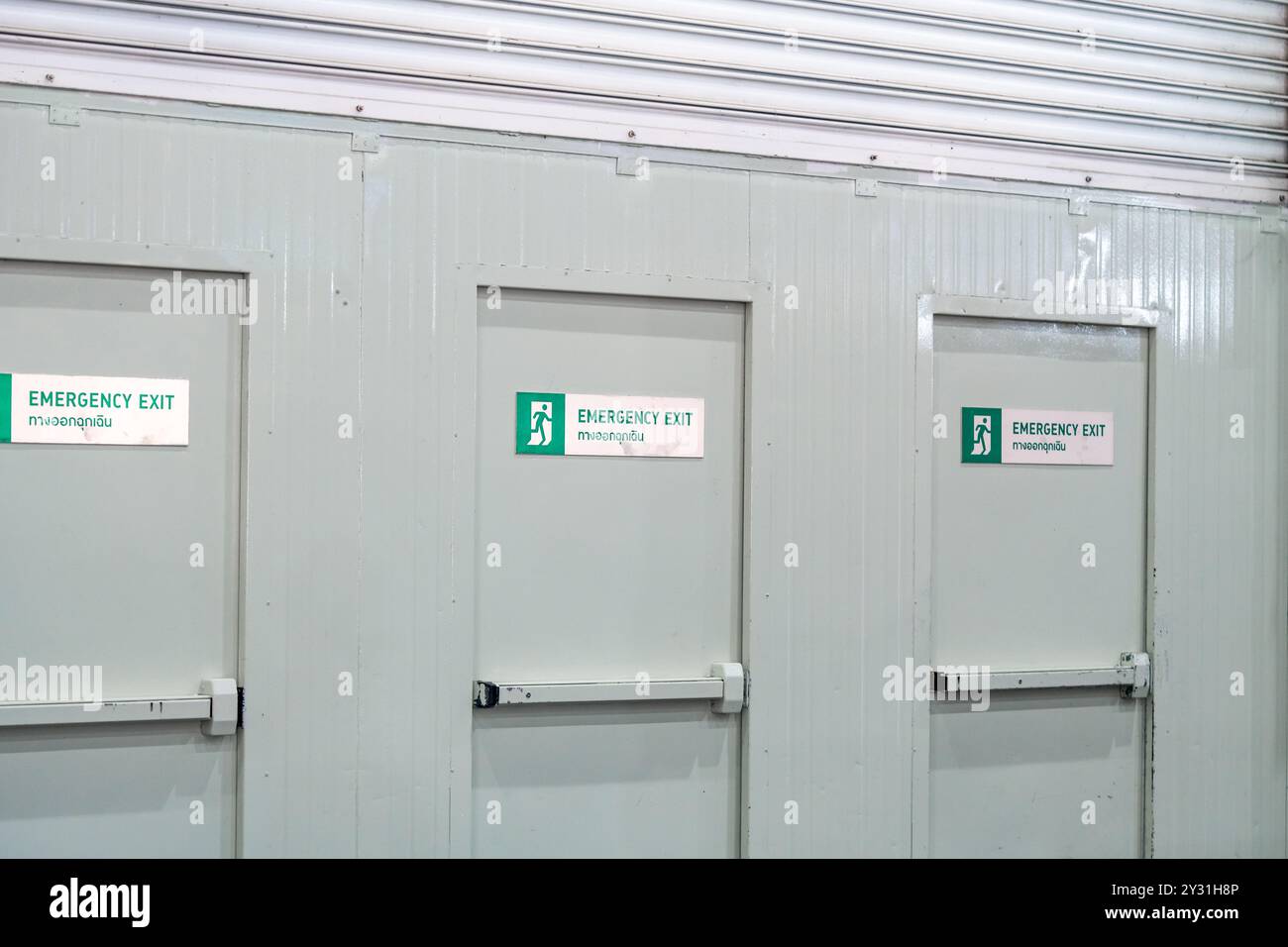 Steel fire doors exit are labeled with emergency exits for inform to ...