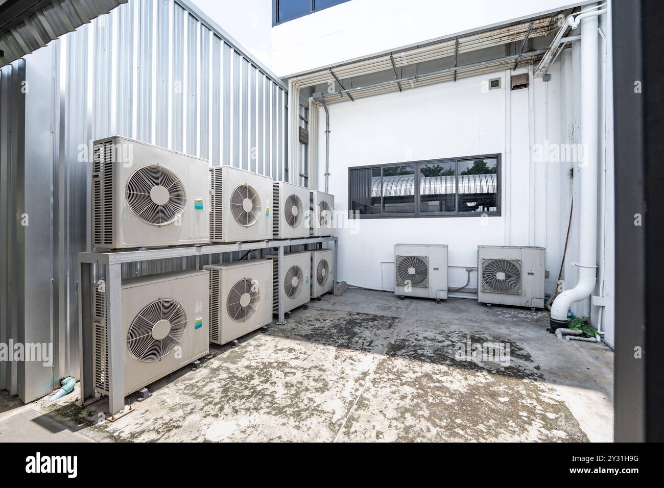 Air conditioning system on ground side of habitat. Multiple white ...