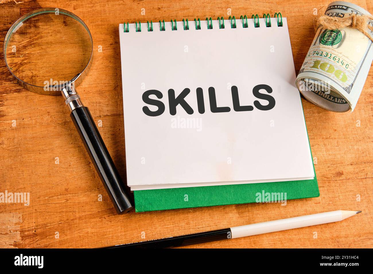 Upskilling and personal development concept. SKILLS words in a notebook ...