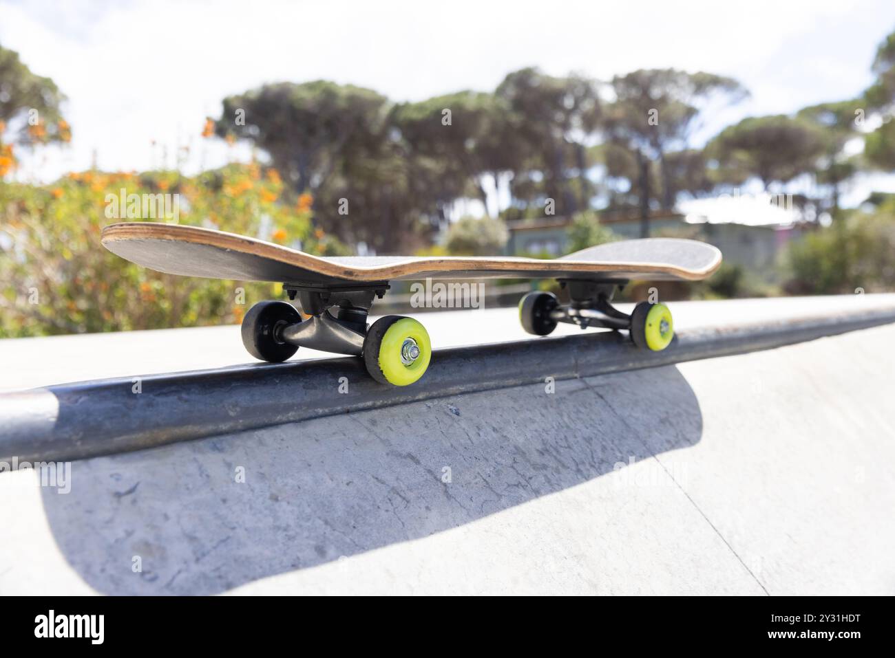 Skateboard balancing on edge of ramp at outdoor skate park Stock Photo ...