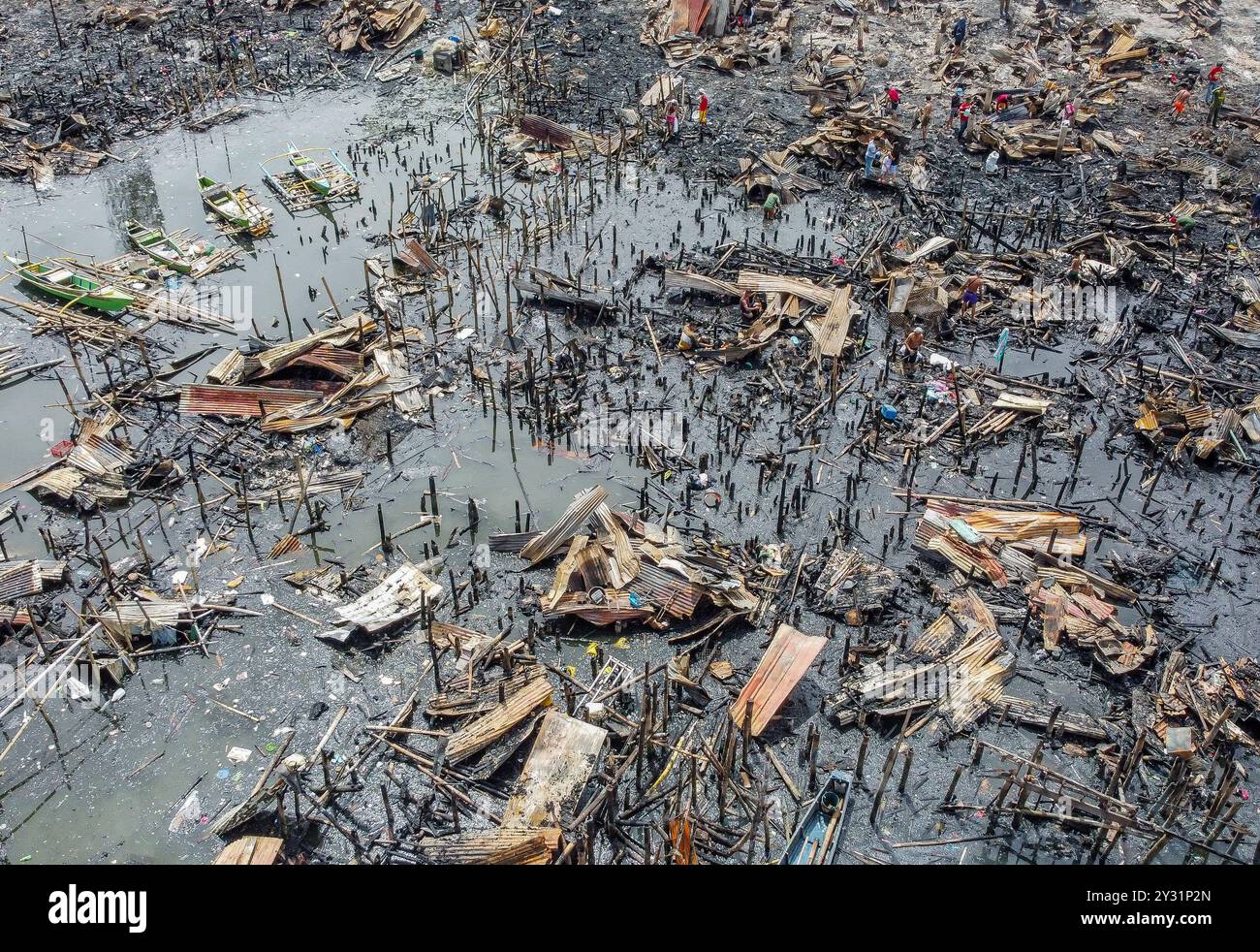 Beijing, China. 11th Sep, 2024. An aerial drone photo shows charred ...