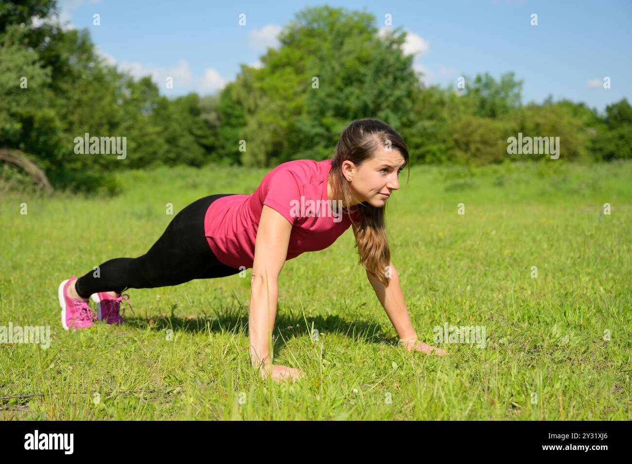 Woman doing push ups outdoors hi-res stock photography and images - Alamy