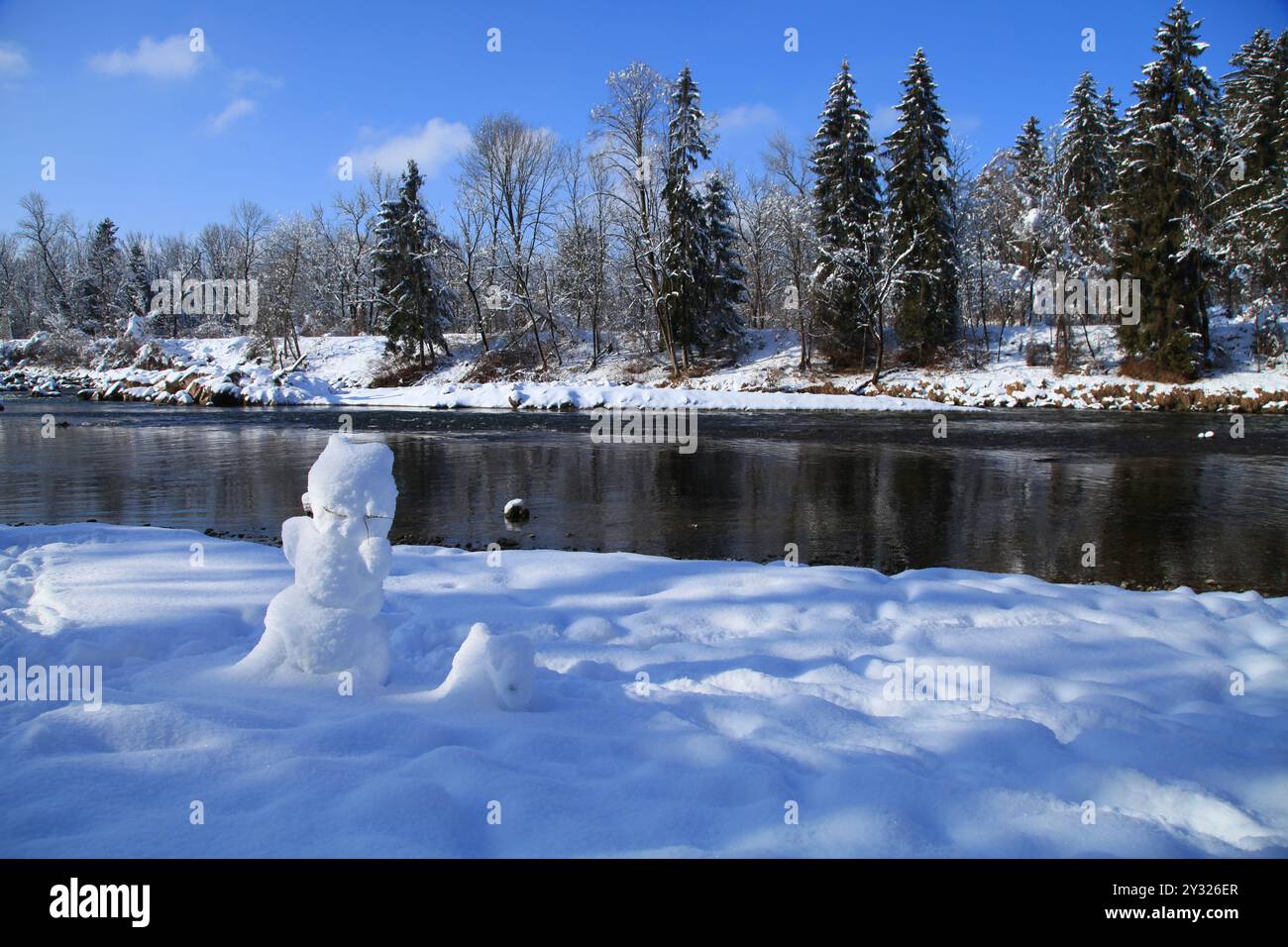 snow man at isar river in munich germany snow cold ice winter season ...