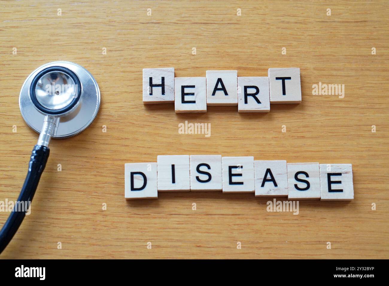 HEART DISEASE. wooden letters with stethoscope Stock Photo - Alamy