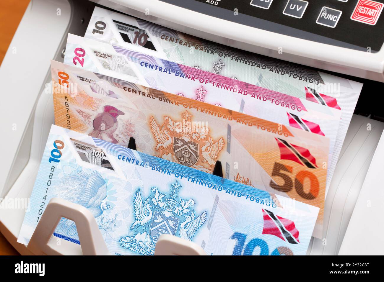 Trinidad and Tobago money - dollar in the counting machine Stock Photo ...