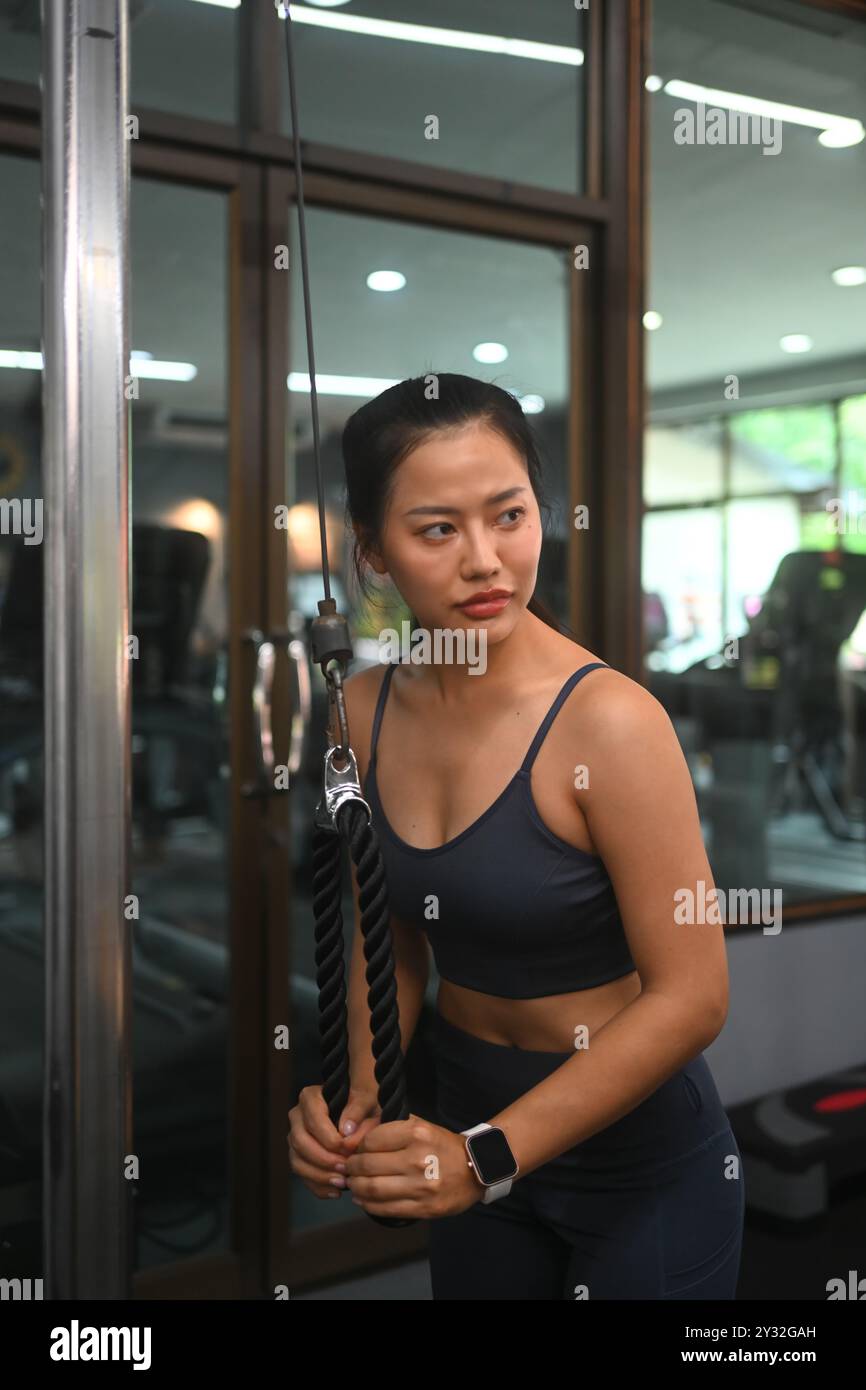 Woman doing cable crossover exercises hi-res stock photography and images - Alamy