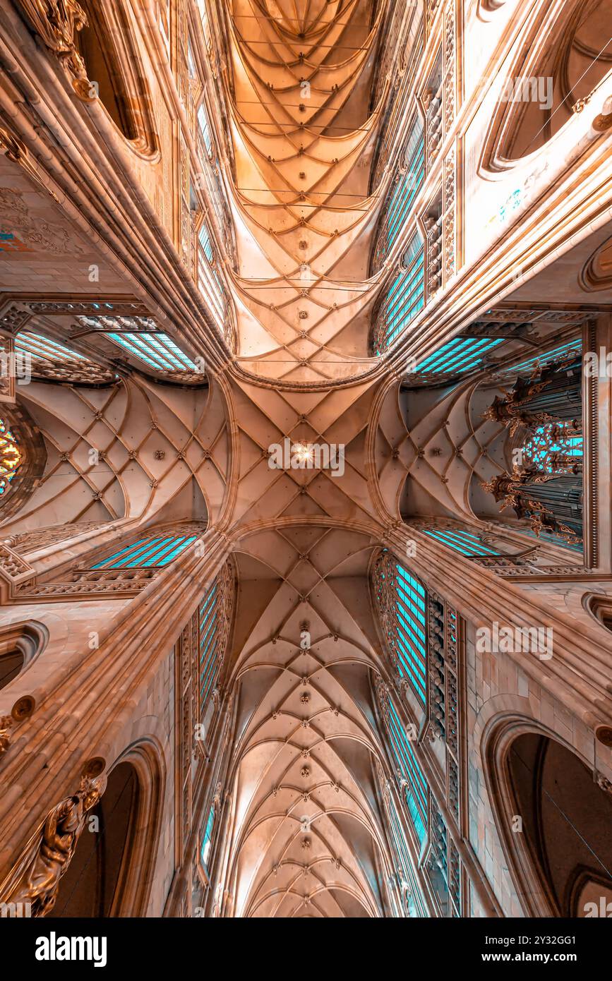 Sunlight shines through stained glass windows illuminating medieval ...