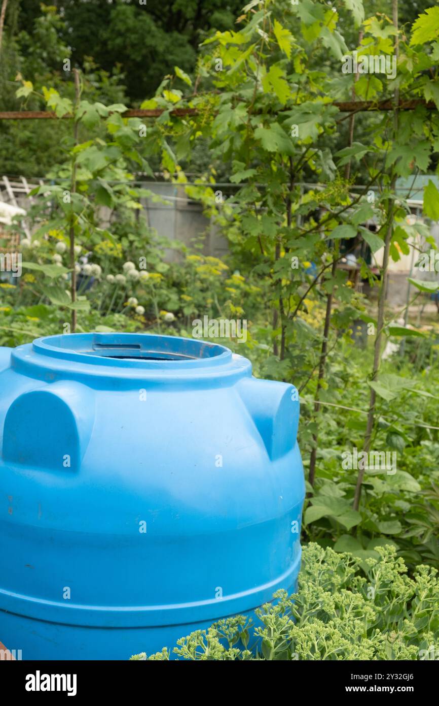 water collection tank under a roof with a drain. Rain water harvesting ...