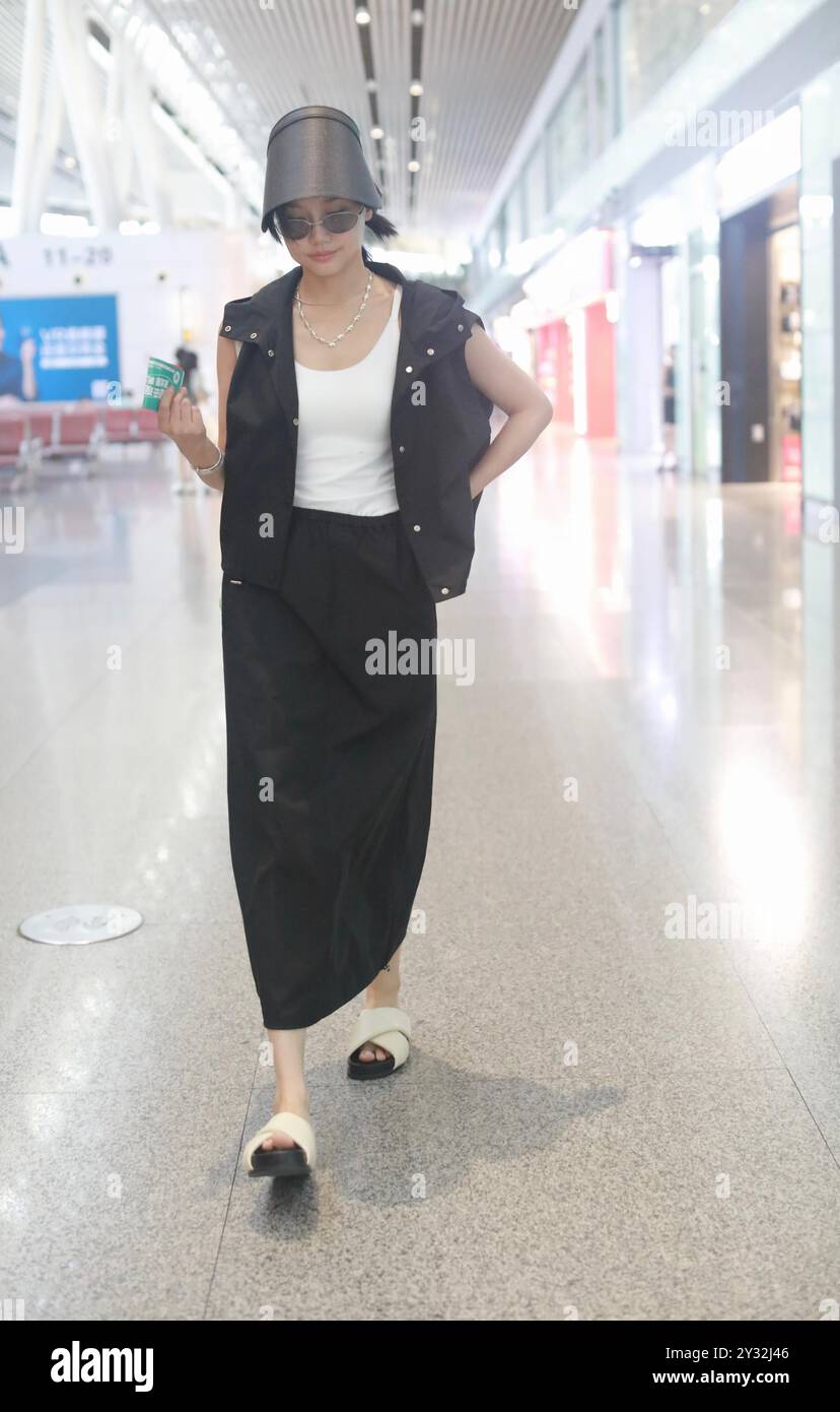 Chinese singer Huang Ling appears at the airport in Changsha City ...
