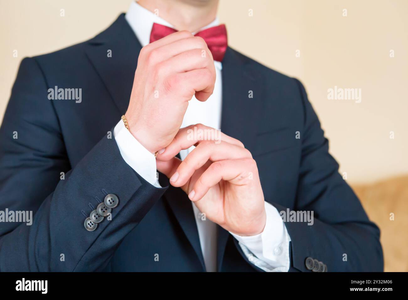 Man Adjusting Cufflinks in a Tuxedo While Preparing for a Formal Event ...