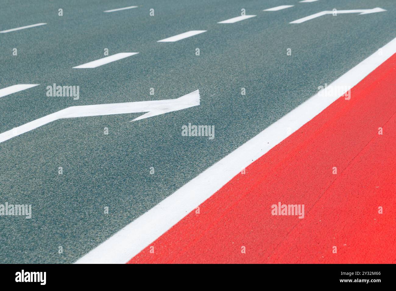 Road markings. Right turn sign and dedicated red bike path Stock Photo ...