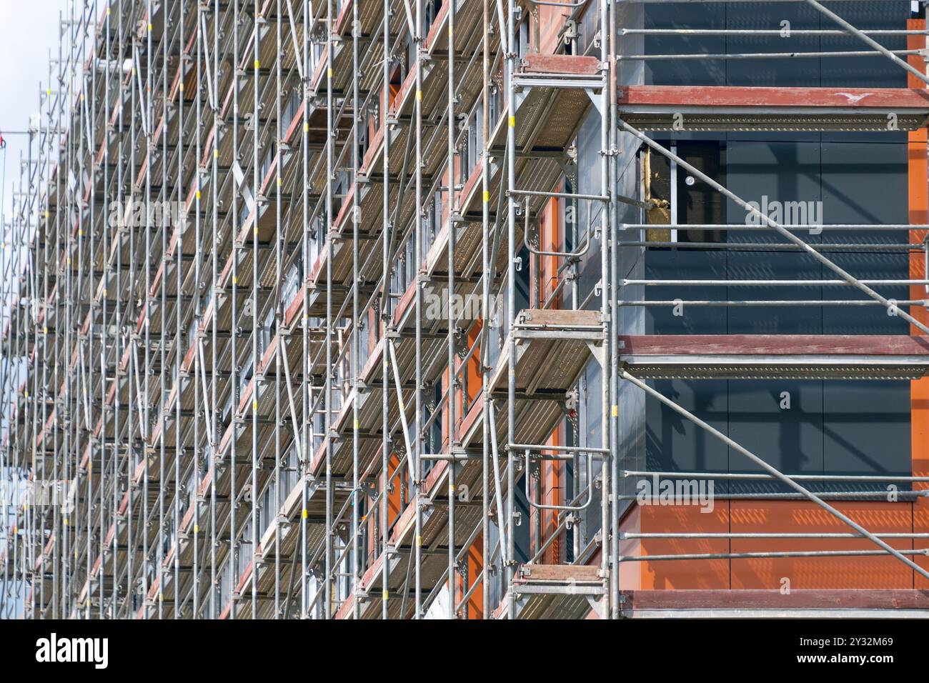 Scaffolding outside the building. Assembly and construction work Stock ...