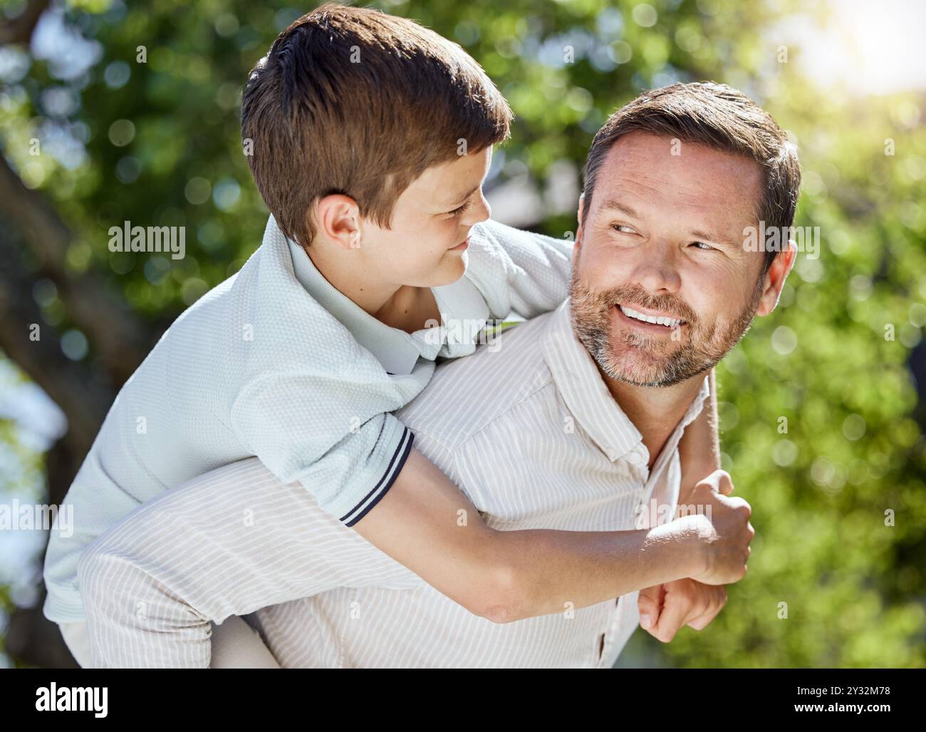 Piggyback, happy and kid with father in nature for bonding, travel and ...