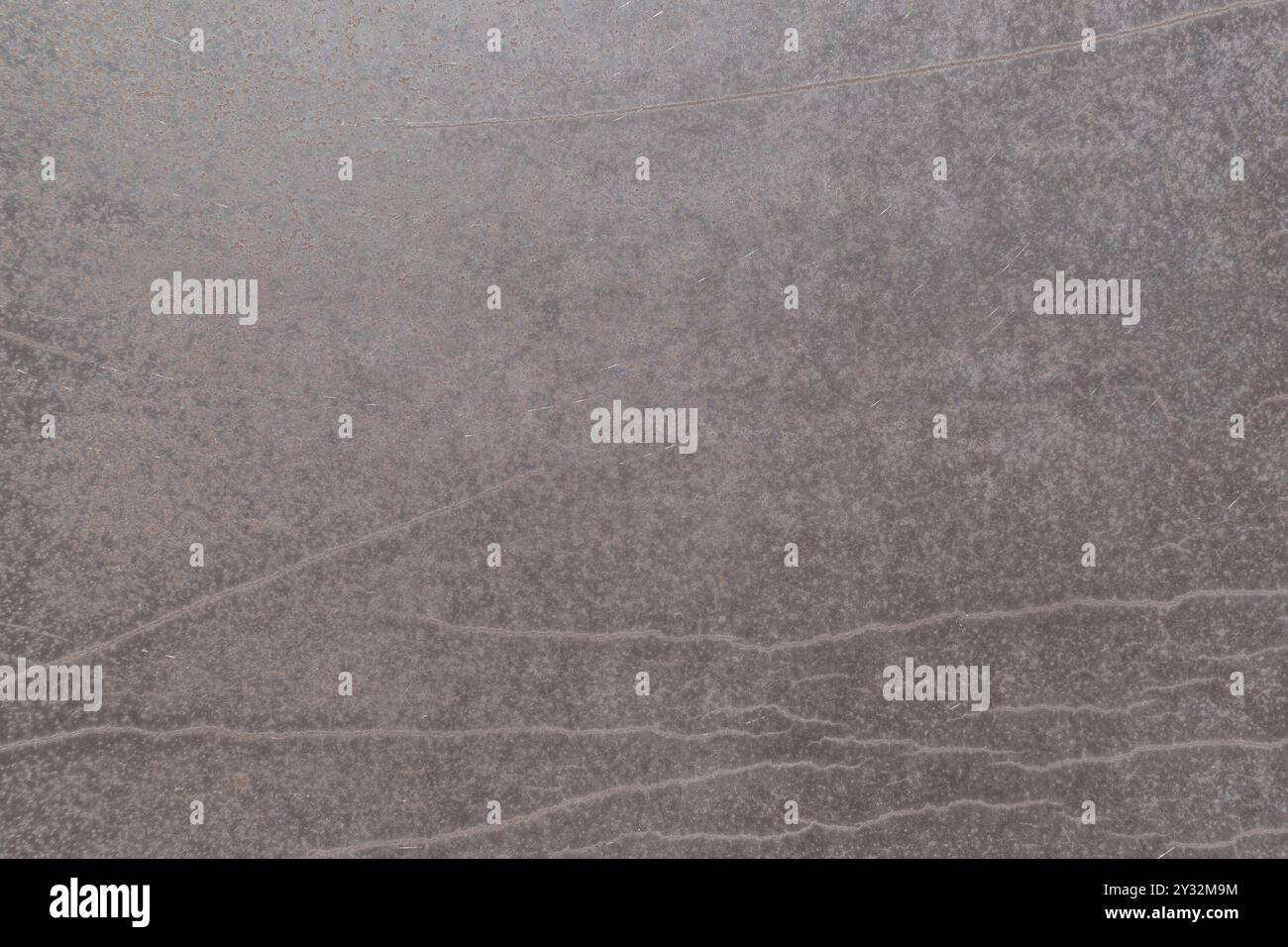 A textured surface with subtle lines and organic patterns, resembling ...