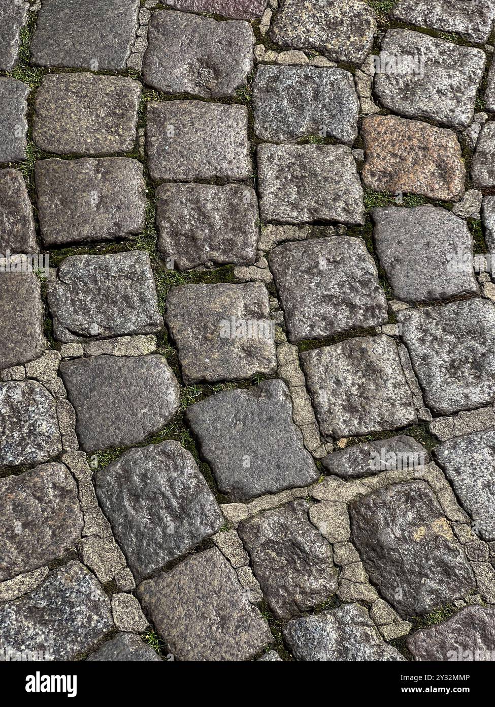 Abstract background, Old cobblestone close-up, top view. Texture of ...