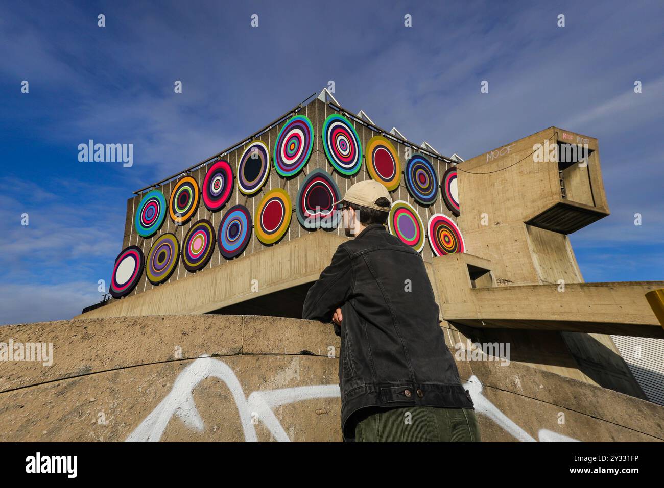 London, UK. 12th Sep, 2024. A member of staff poses with the work ...