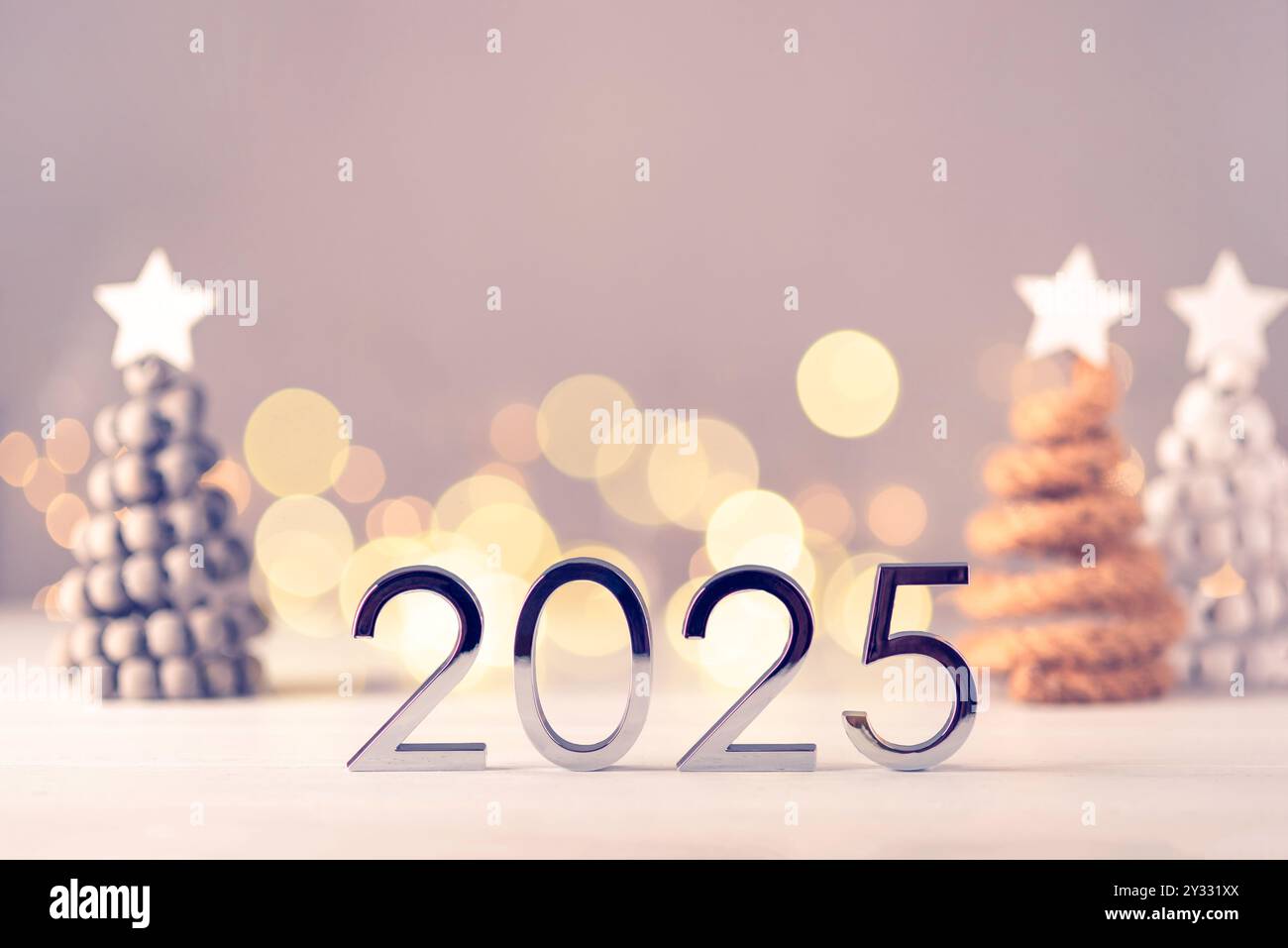 Metal numbers 2025 on table with bokeh lights Stock Photo - Alamy