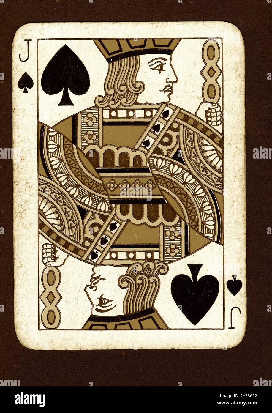 A vintage jack of spades playing card in sepia on a black background ...