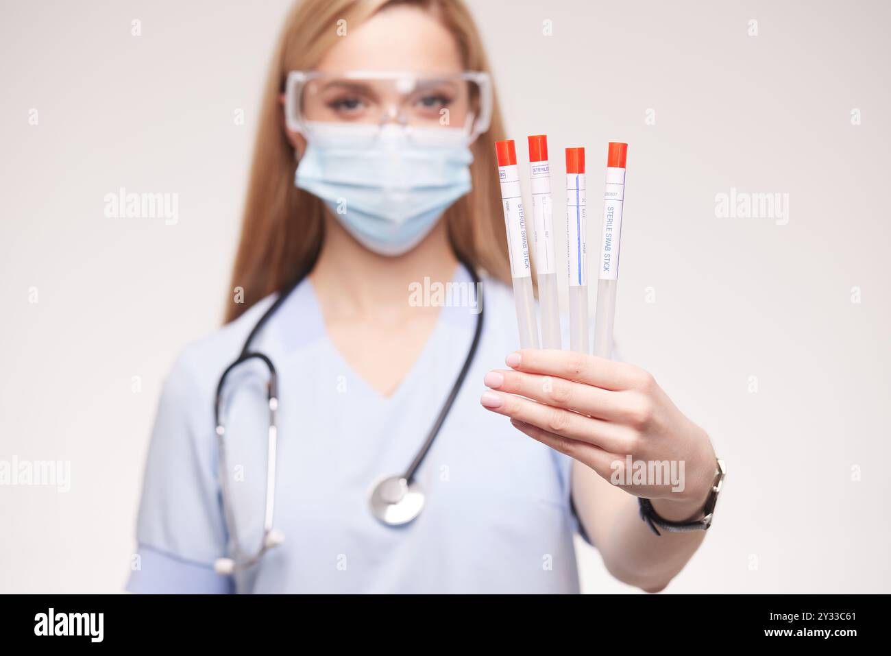 Doctor holding sterile swab stick close up on white background ...