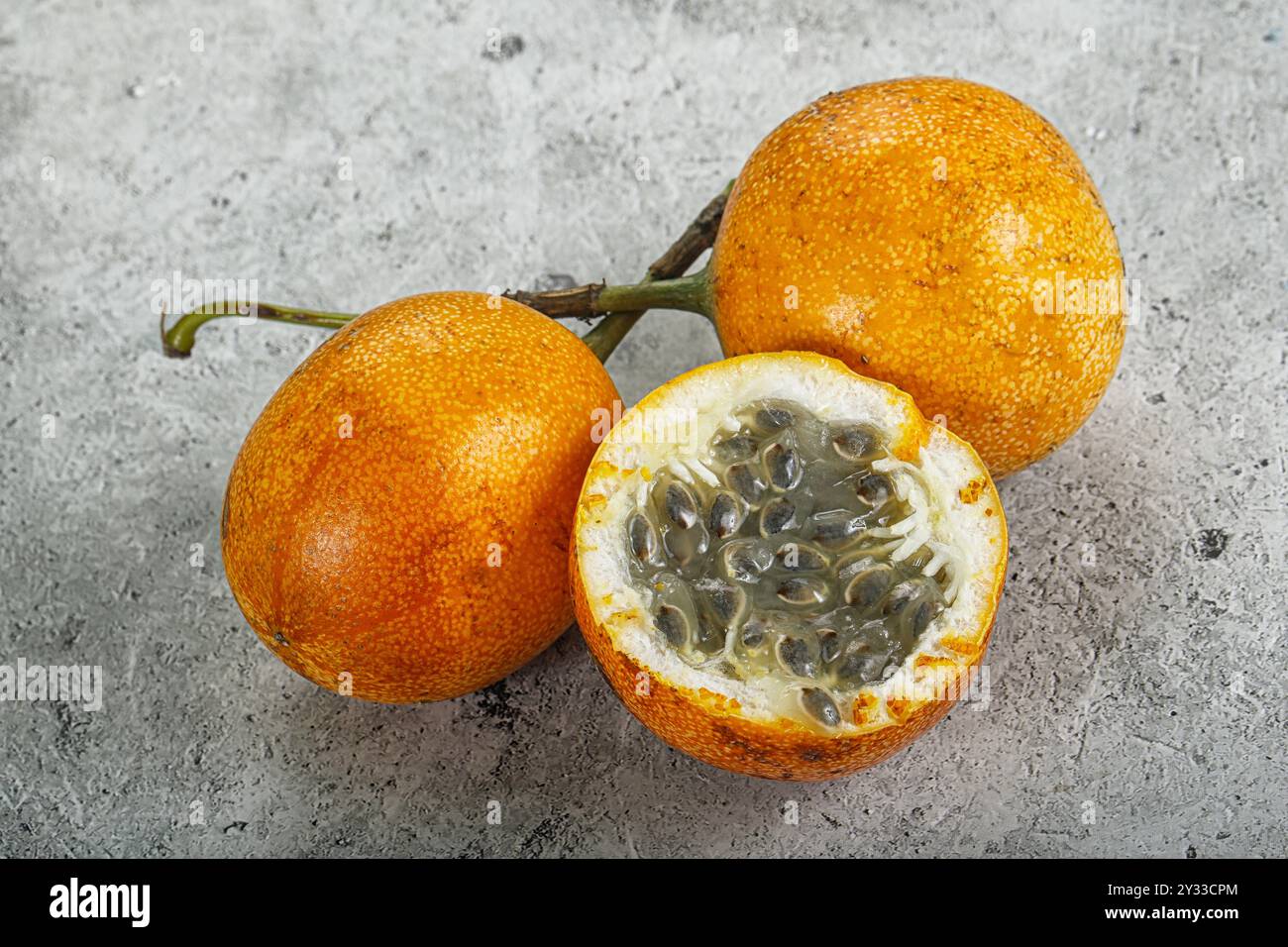 Tropical juice Granadilla Passion fruit slice Stock Photo - Alamy