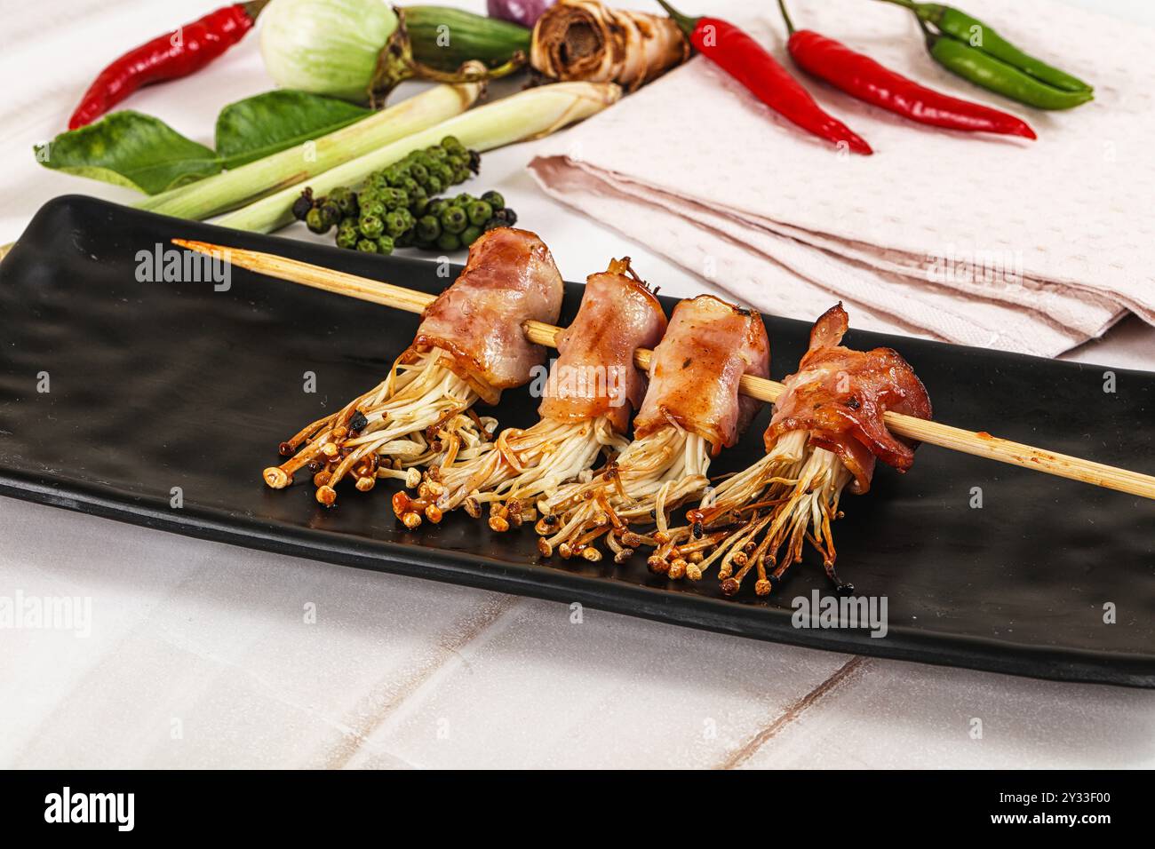 Thai Street foof satay with bacon and mushroom enoki skewer Stock Photo ...