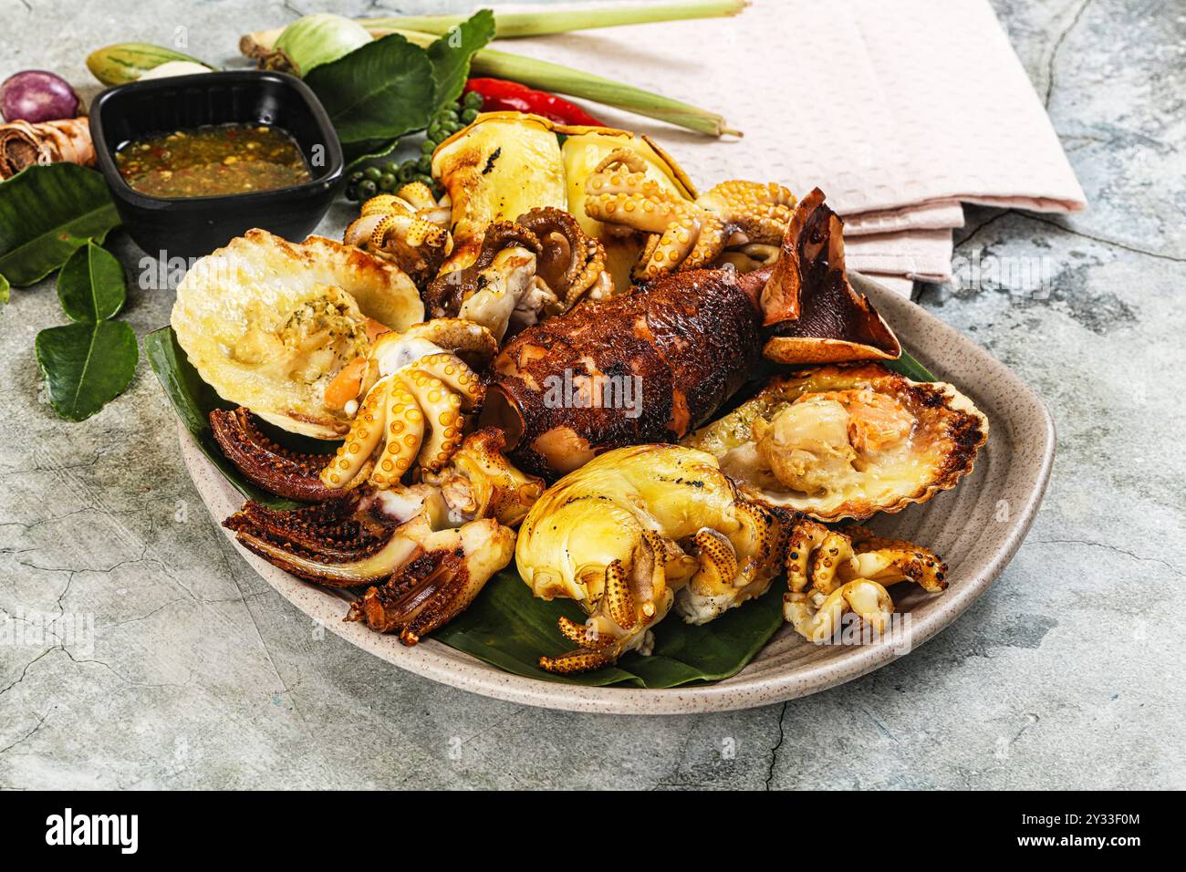 Asian grilled seafood mix plate - squid, cuttlefish, scallops and ...