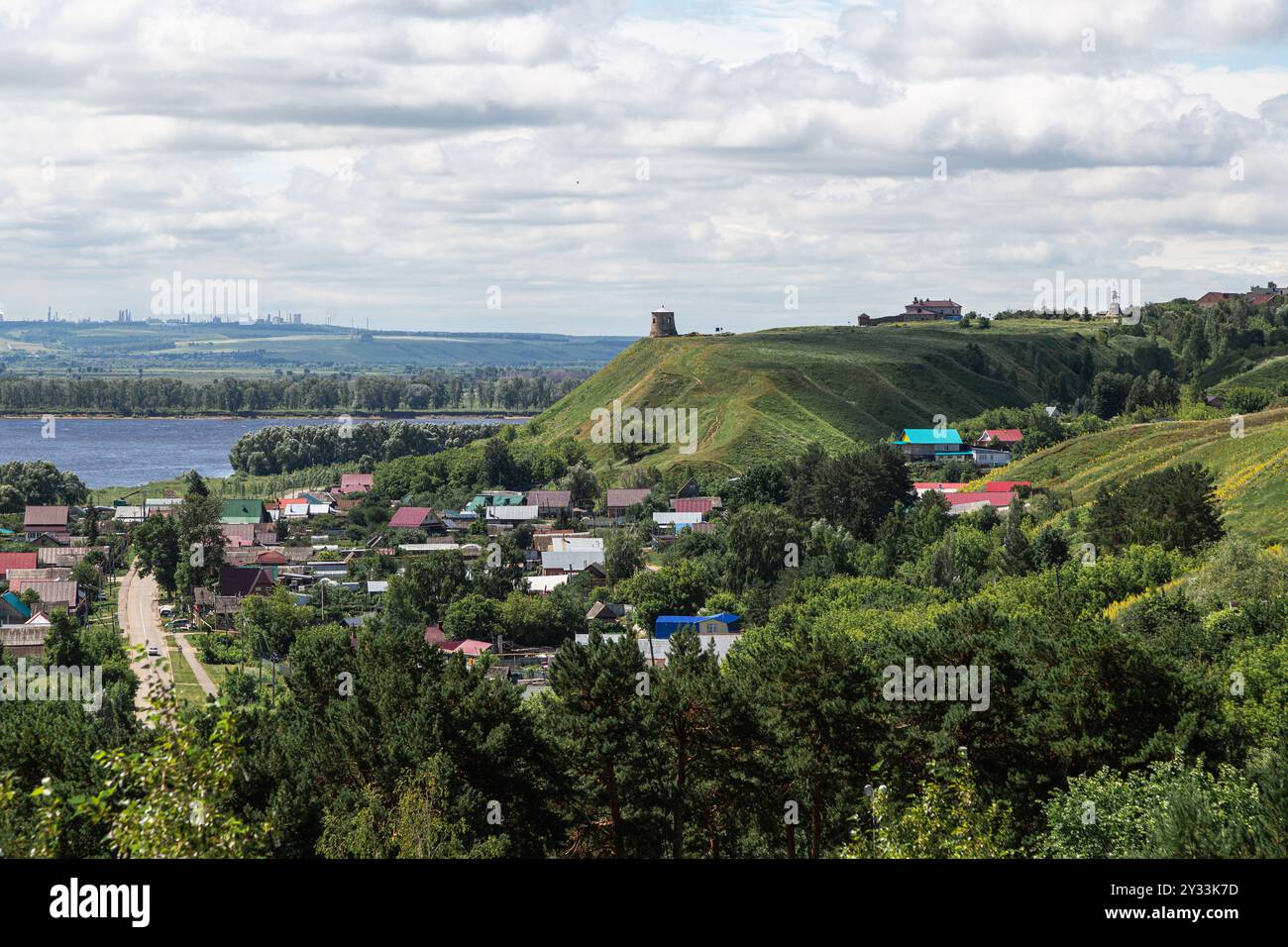 The tower of an ancient Bulgarian fortress on a high cliff on the banks ...