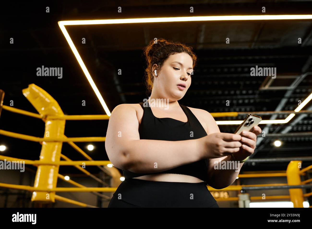 A young woman is engaged in her fitness routine, embracing body ...
