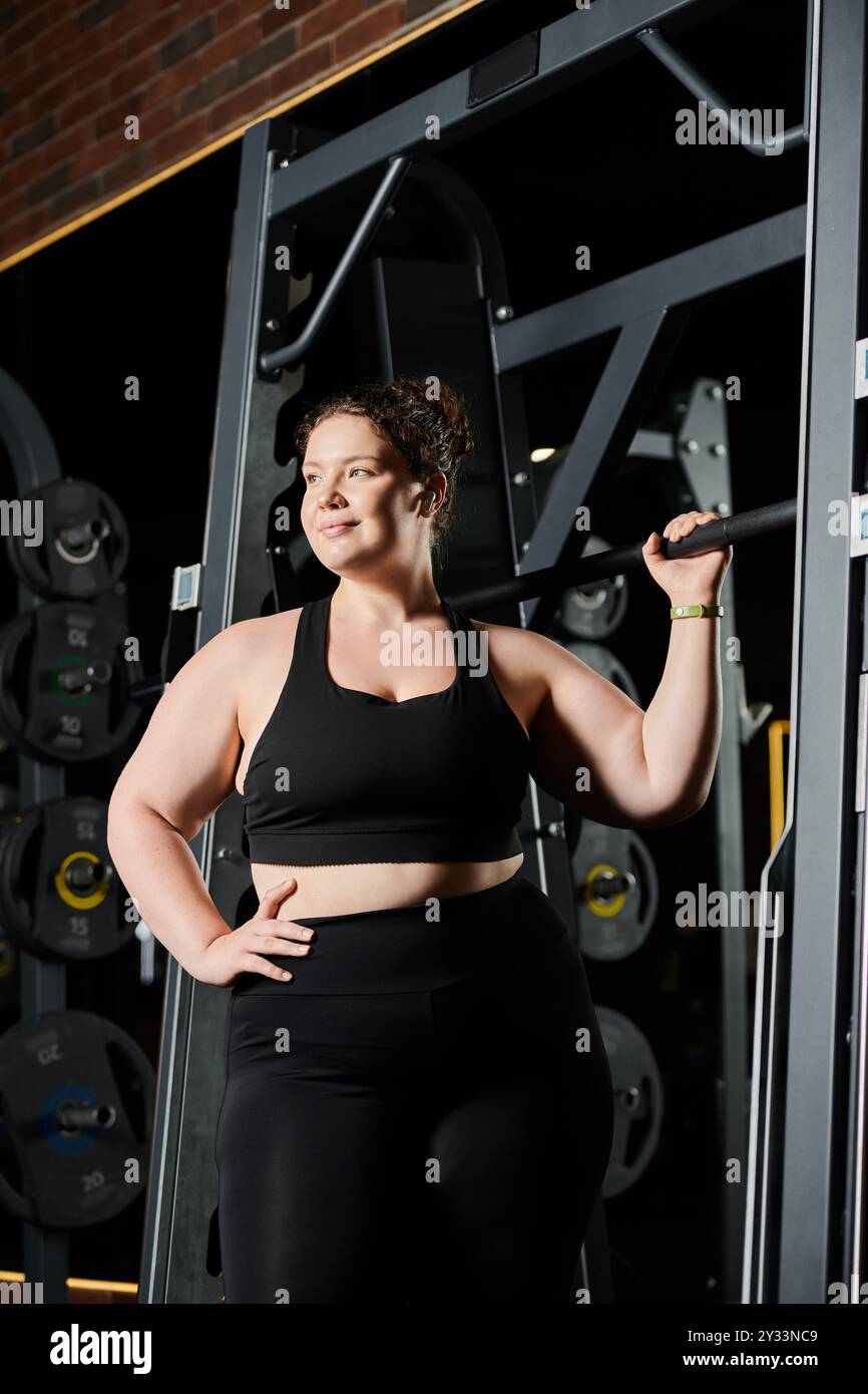 A young woman embraces her strength while working out and uplifting ...