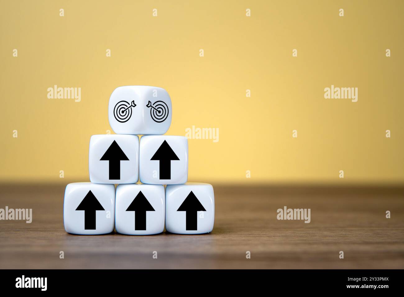 White dice stacked on top of each other with target symbol and upward ...
