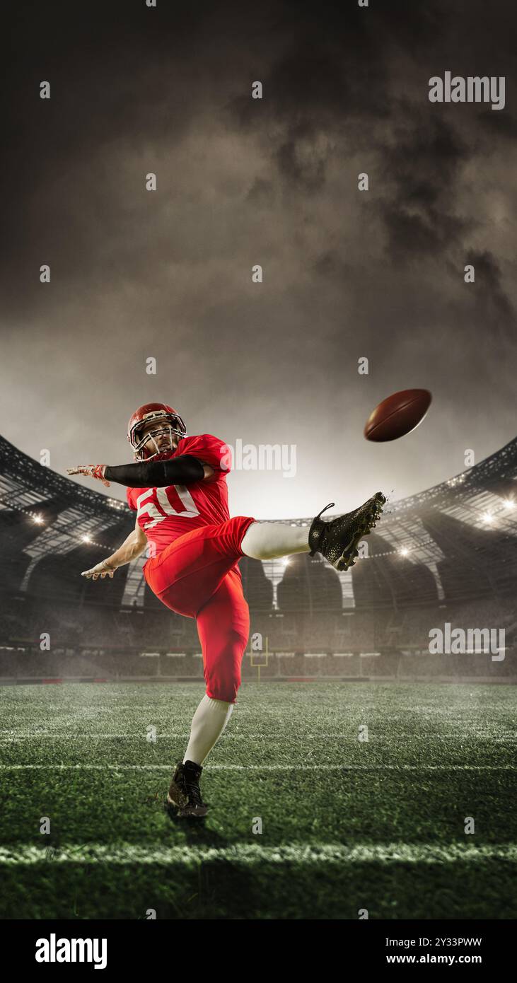 Poster. Player kicks football with forceful swing, mid-action, with ...