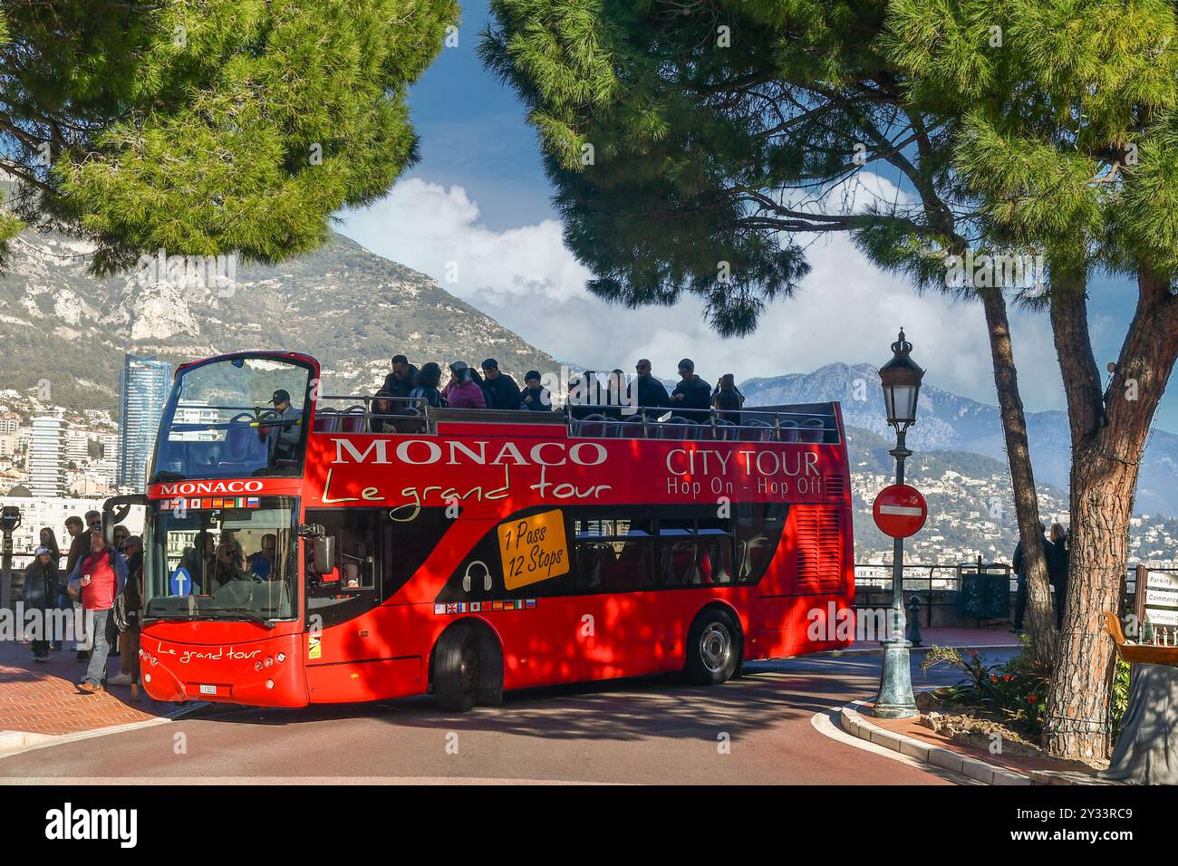 Hop-on Hop-off tourist bus full of people departing from Palace Square ...