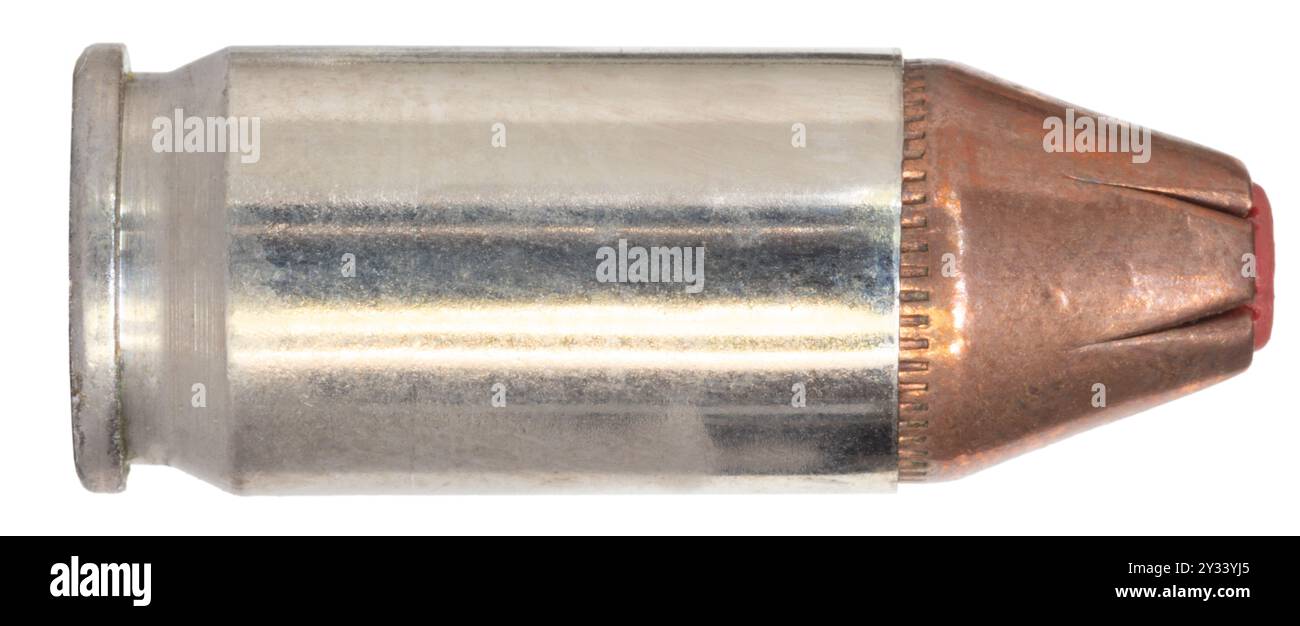Copper plated bullet on a silver colored casing in a cartridge used for ...