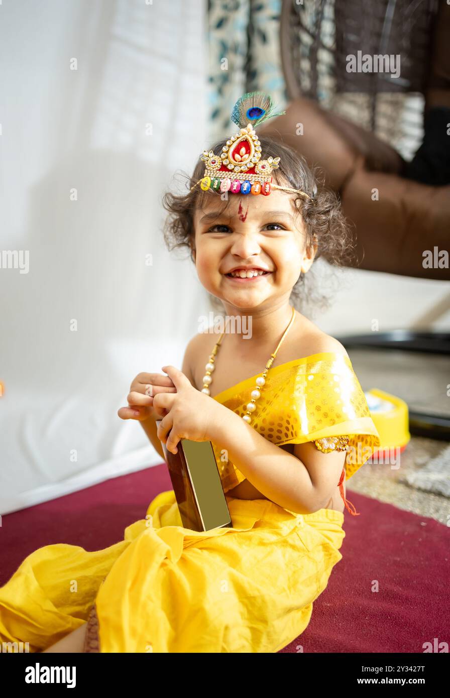 little indian baby boy in holy hindu god kirshna attire at indoor Stock ...