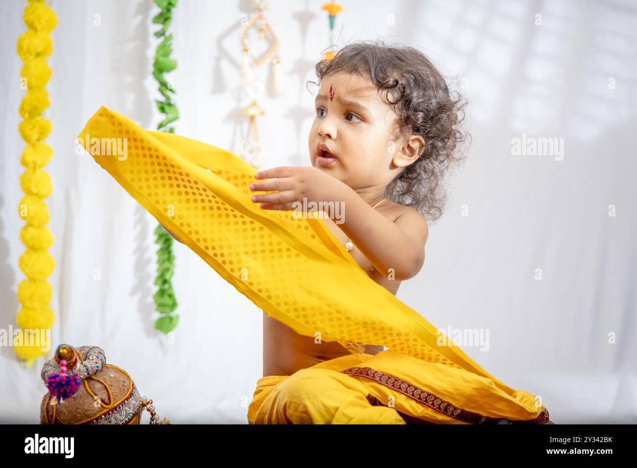 little indian baby boy in holy hindu god kirshna attire at indoor Stock ...
