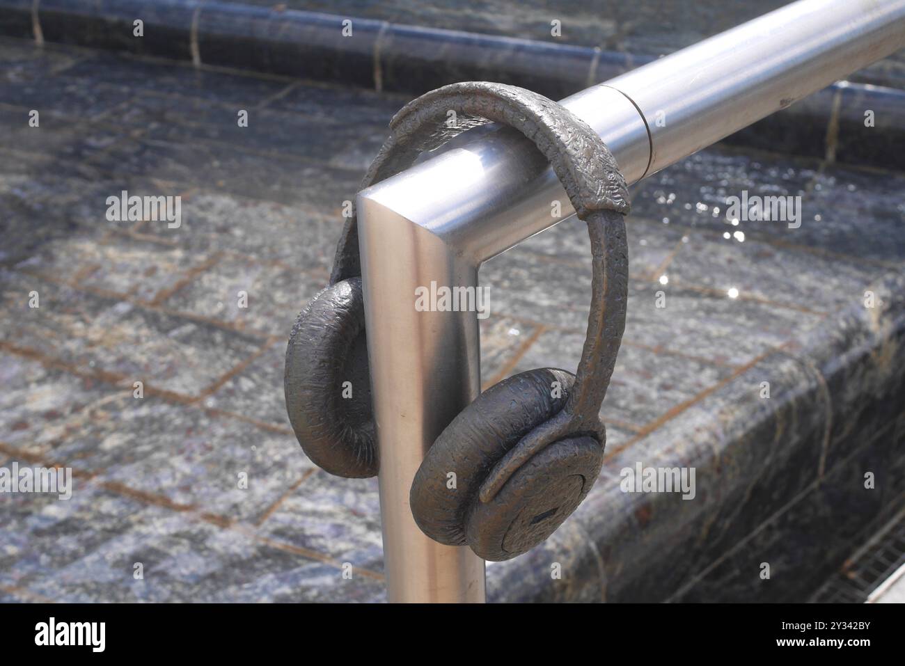 Headphones, a bronze mini statue by Hungarian Ukrainian sculptor Mihaly ...