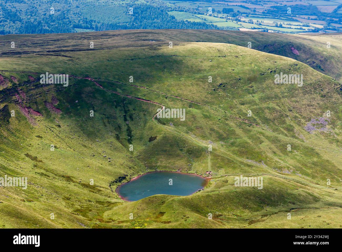 Cwm Llwch lake below Pen-y-Fan and Corn Du mountains in the Brecon ...