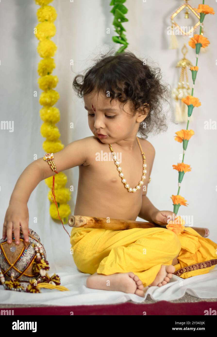 little indian baby boy in holy hindu god kirshna attire at indoor Stock ...