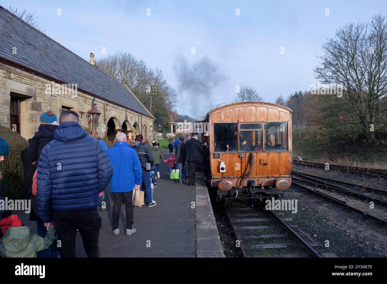 A restored Edwardian train at the platform, the railway station at ...